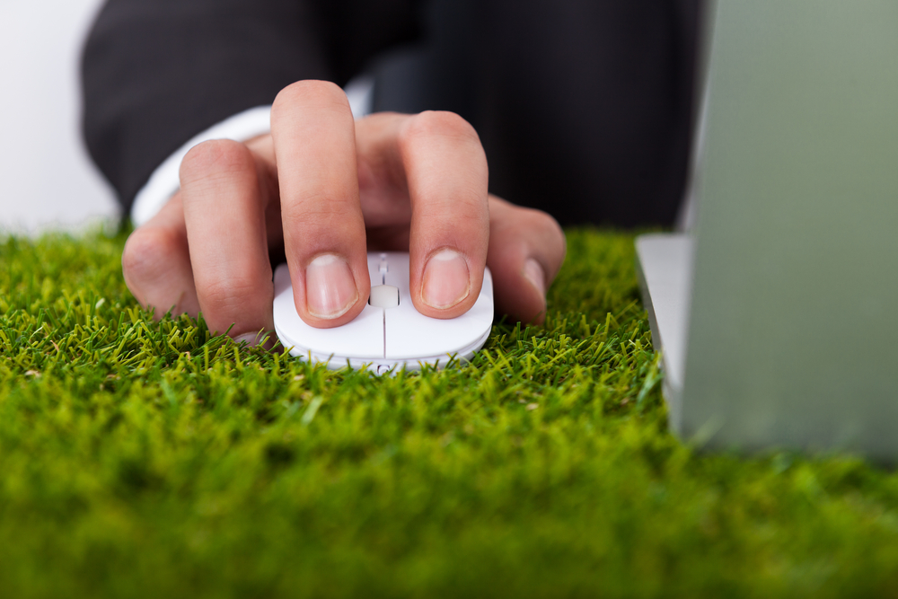 Midsection,Of,Businessman,Using,Laptop,With,Computer,Mouse,On,Grass ...